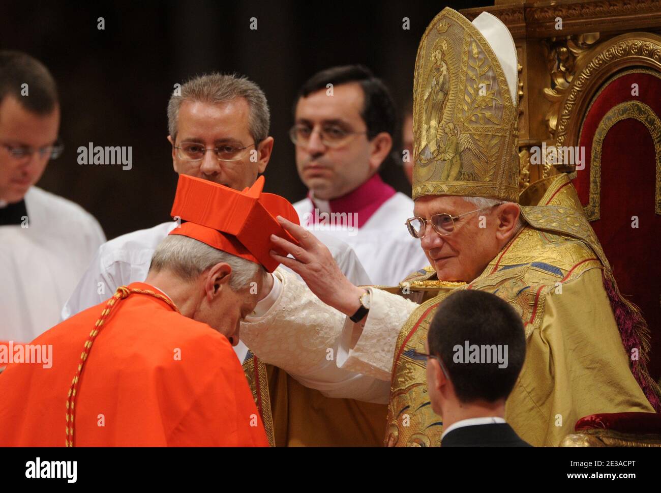 New cardinal Donald William Wuerl (USA) receives the biretta cap from ...