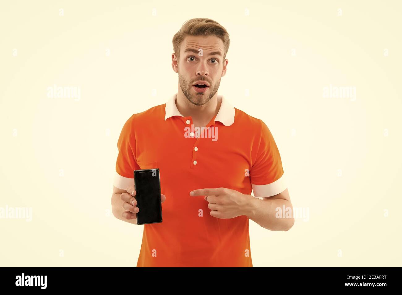 Have you seen this. Surprised man pointing at smartphone isolated on ...