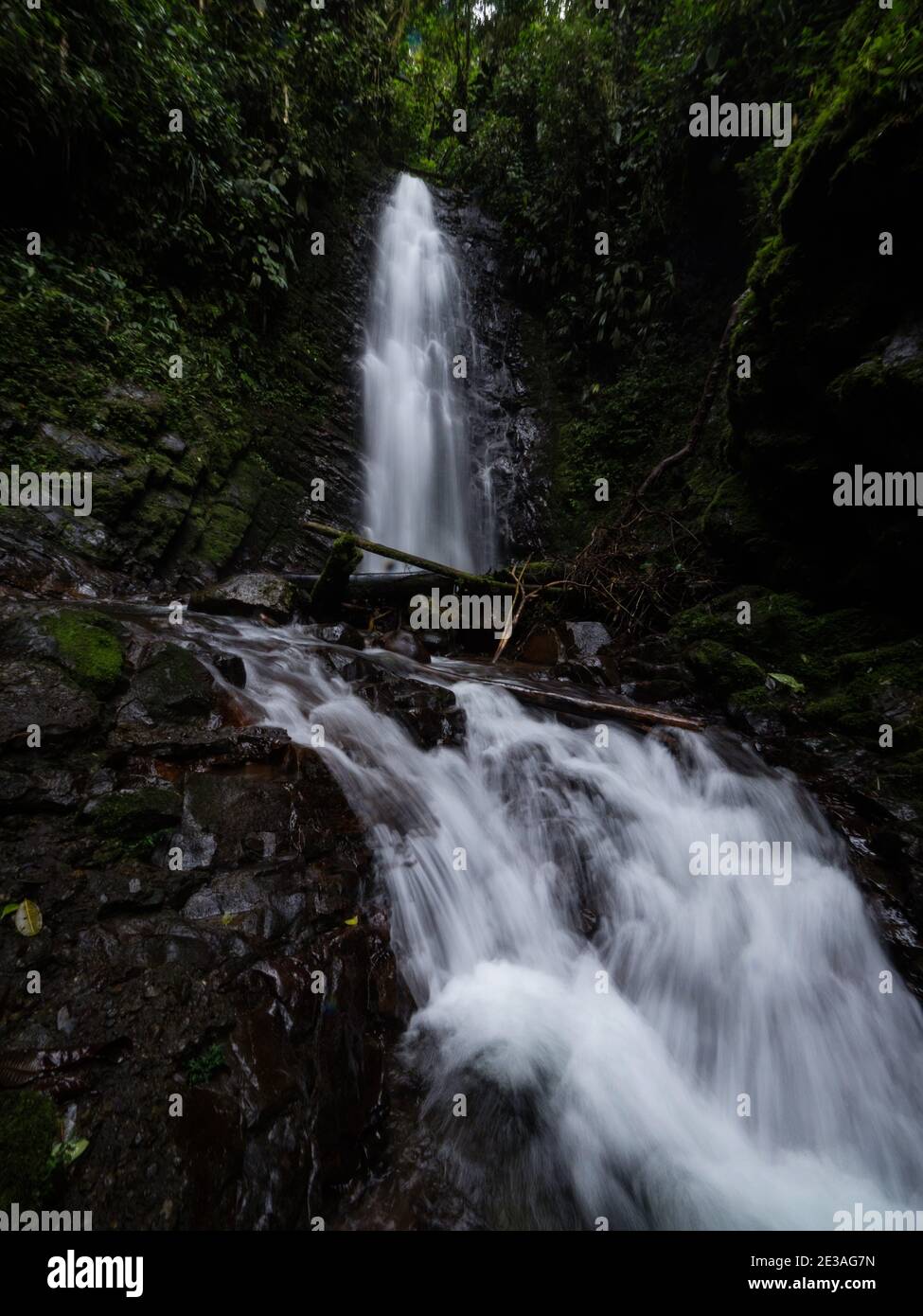 Panorama view of Cascada de Reina waterfall in tropical rain cloud ...
