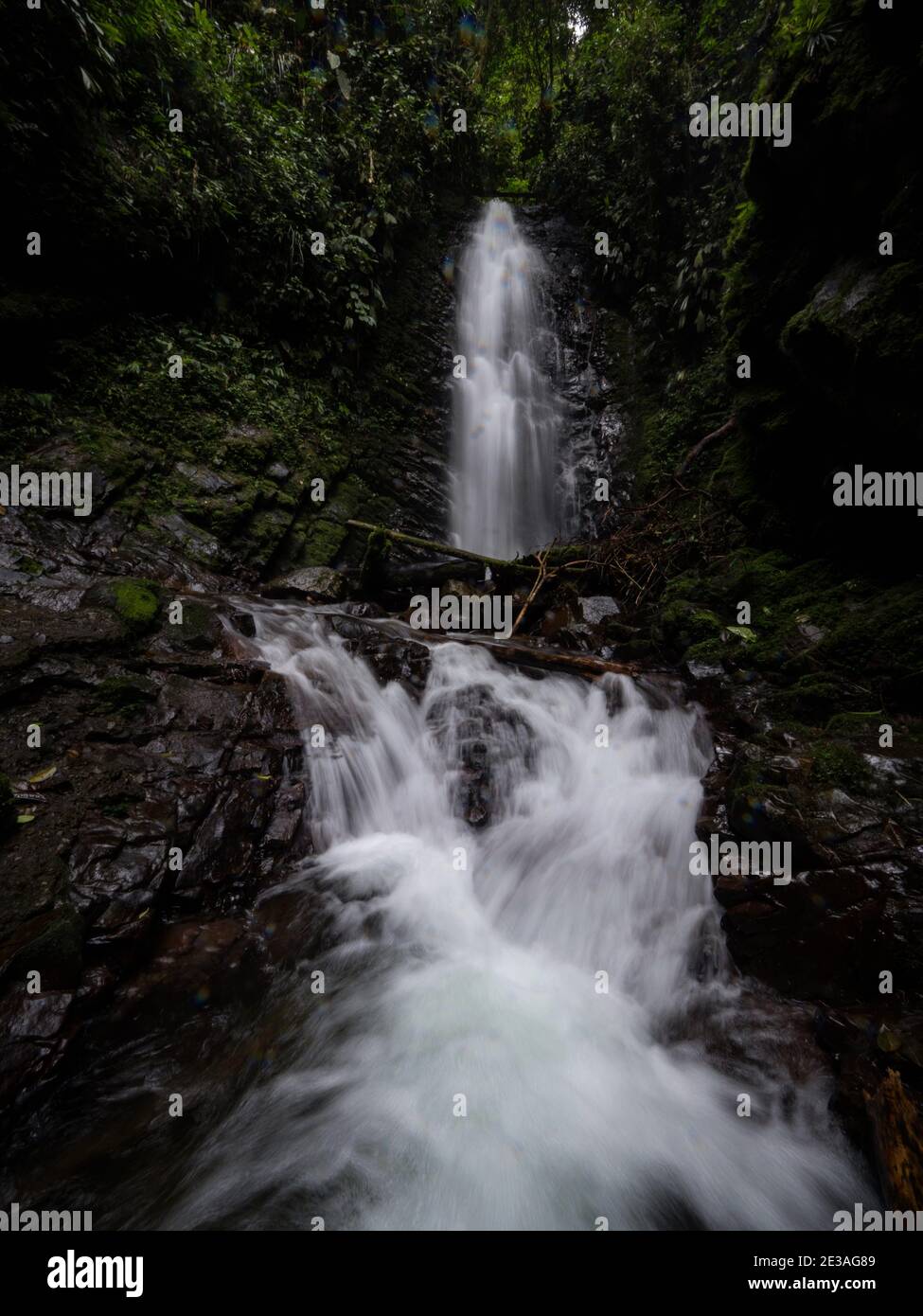 Panorama view of Cascada de Reina waterfall in tropical rain cloud ...