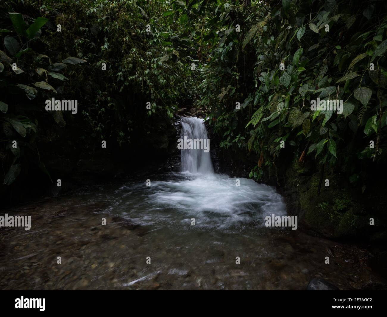 Panorama view of Cascada Ondinas waterfall in tropical rain cloud ...