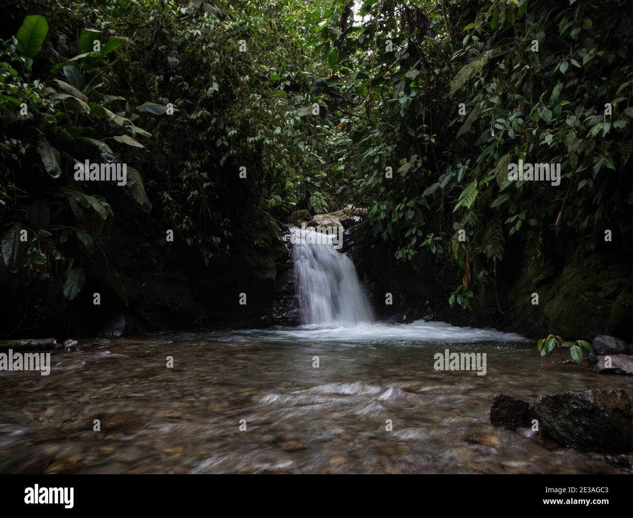 Panorama view of Cascada Ondinas waterfall in tropical rain cloud ...