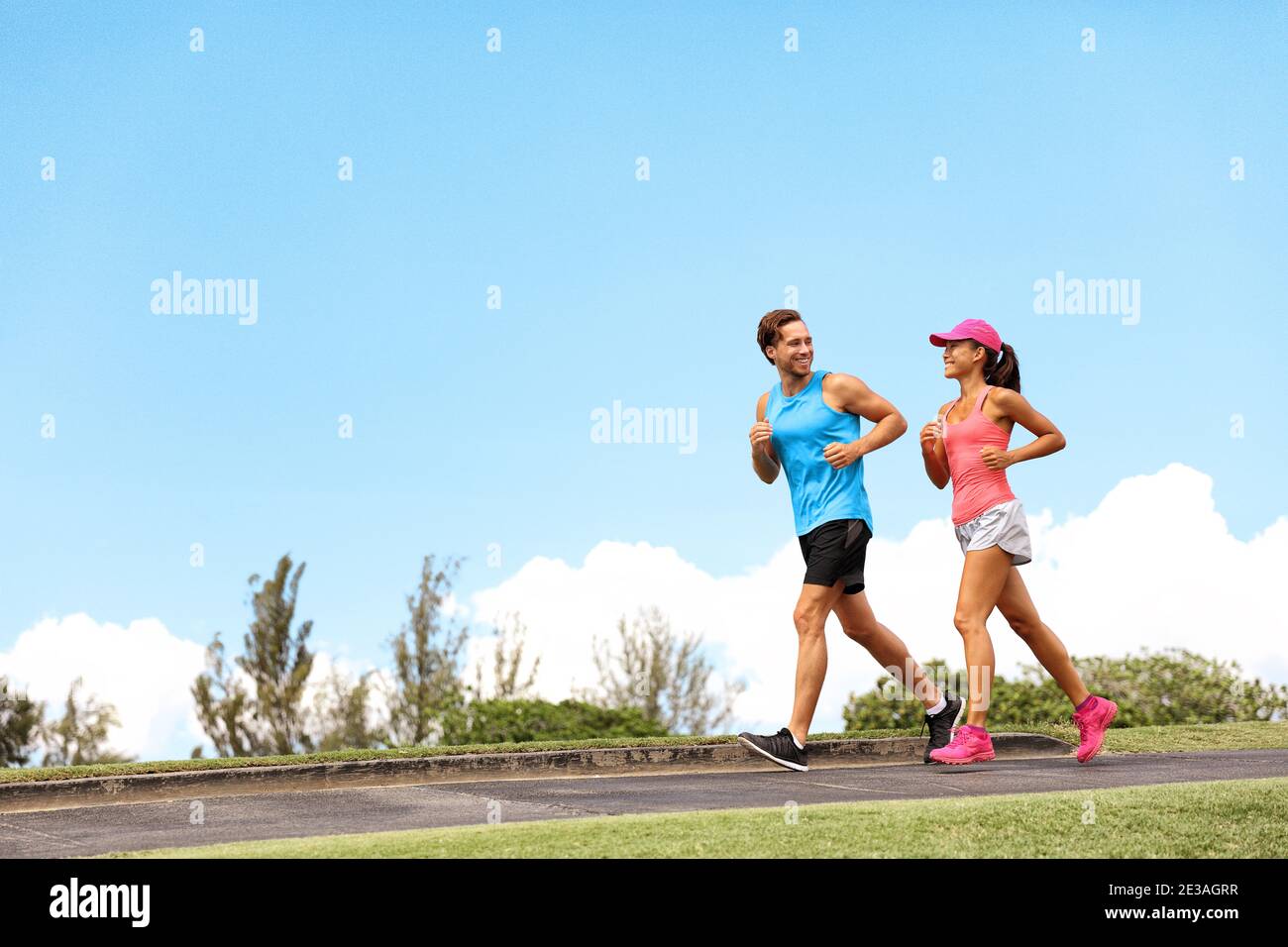 Runners athlete fit people running on street - summer active lifestyle ...