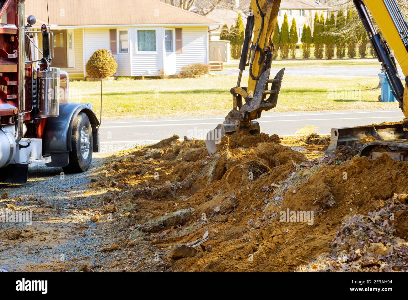 Excavator machine unloading soil earth moving construction works Stock ...