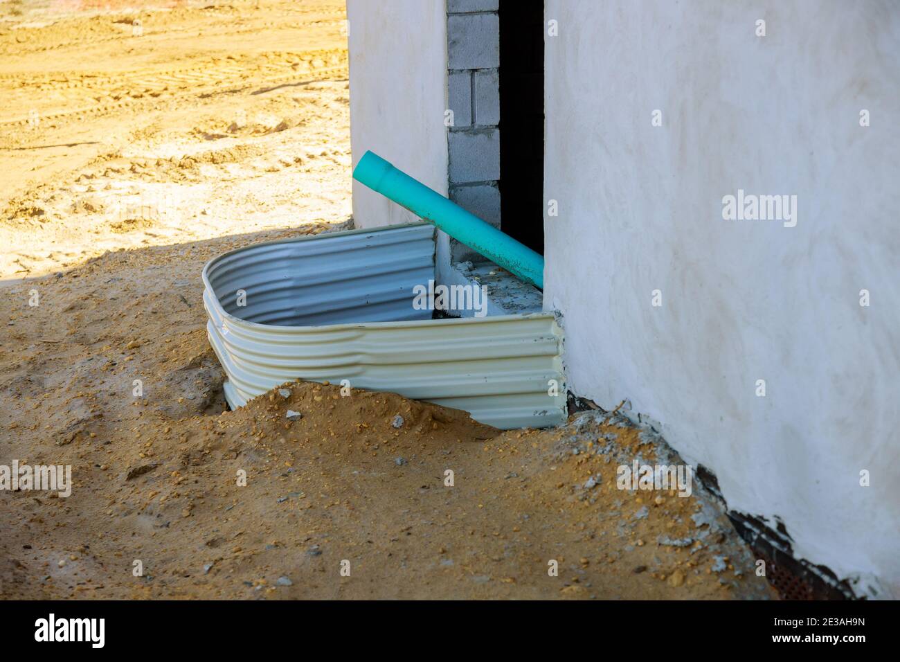 Residential on a new home installation window well for basement ...