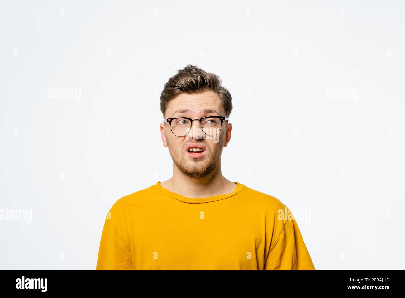 Shocked man in yellow hi-res stock photography and images - Alamy