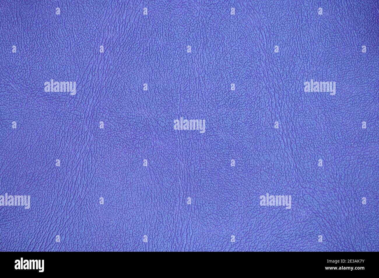 A fragment of genuine leather with folds, artificially colored in a ...