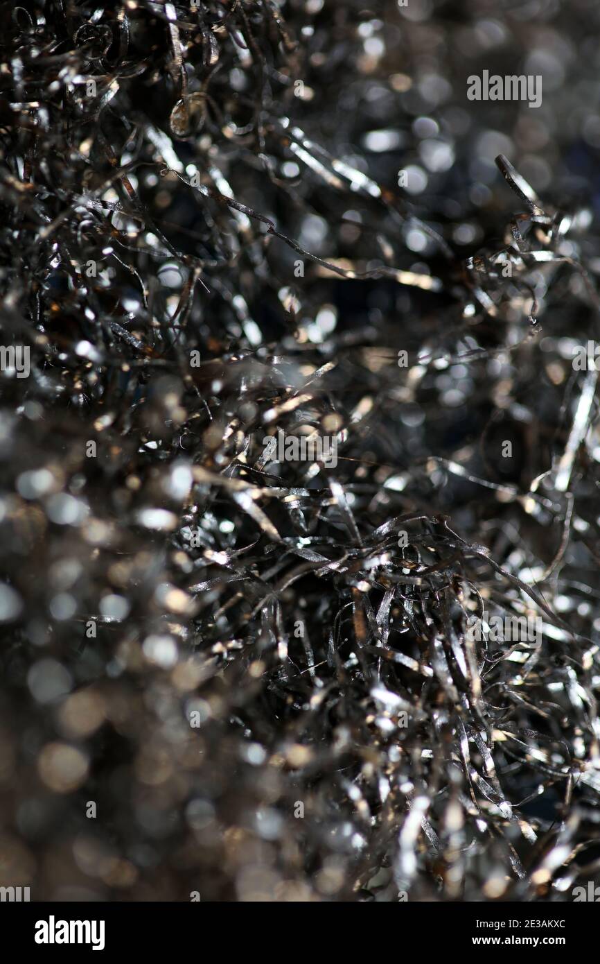Steel curly dish washing metal wire close up macro modern background ...