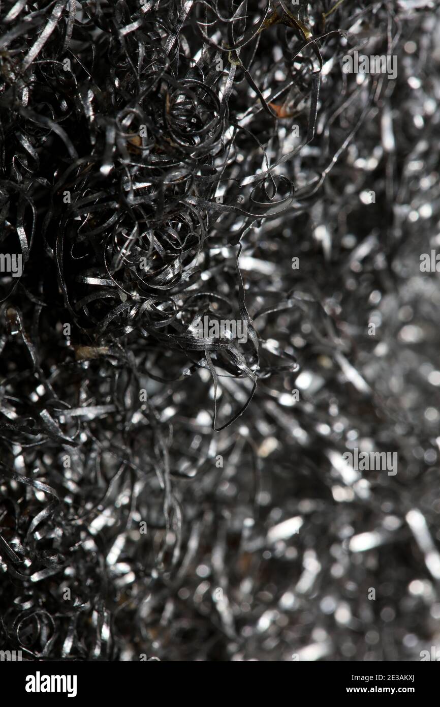 Steel curly dish washing metal wire close up macro modern background ...