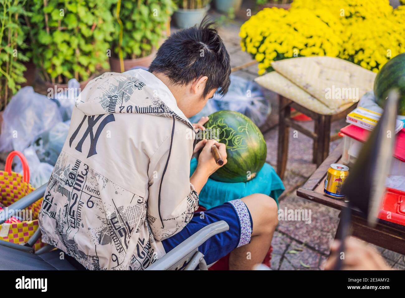 Vietnam, Nha Trang, January 23, 2020: Asian man working on pavement of ...