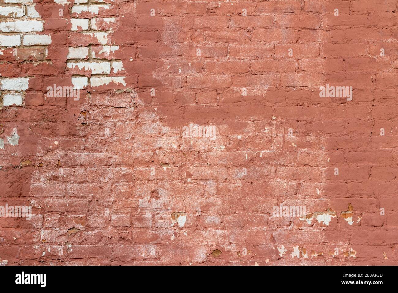 Full frame abstract background of an antique rose color painted brick ...