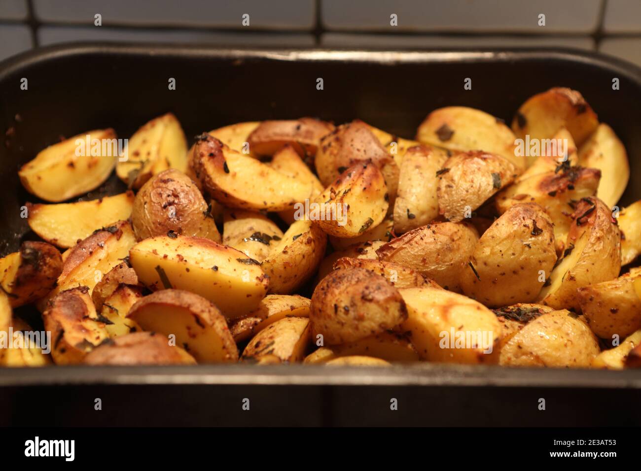 Baked potatoes with Provencal herbs Stock Photo - Alamy