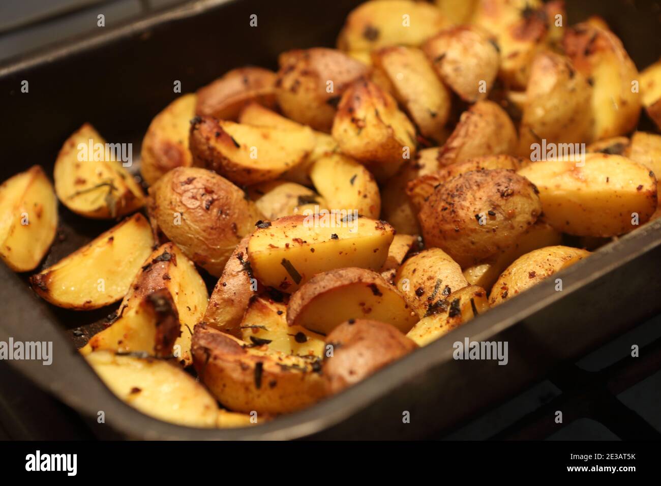 Baked potatoes with Provencal herbs Stock Photo - Alamy