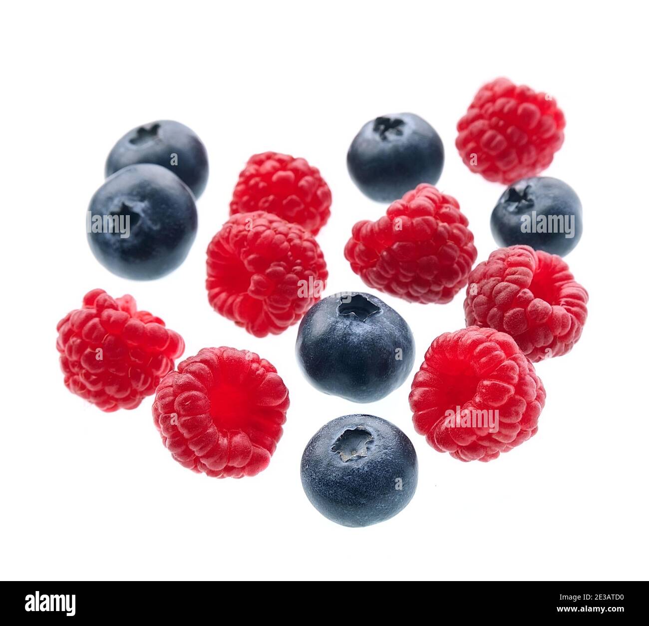 Falling raspberry and blueberries in closeup Stock Photo - Alamy