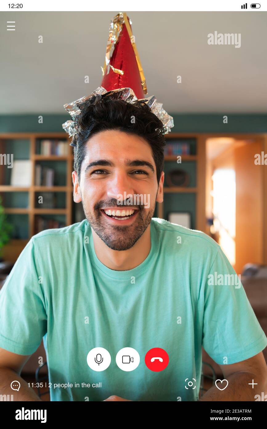Man celebrating his birthday on a video call Stock Photo - Alamy