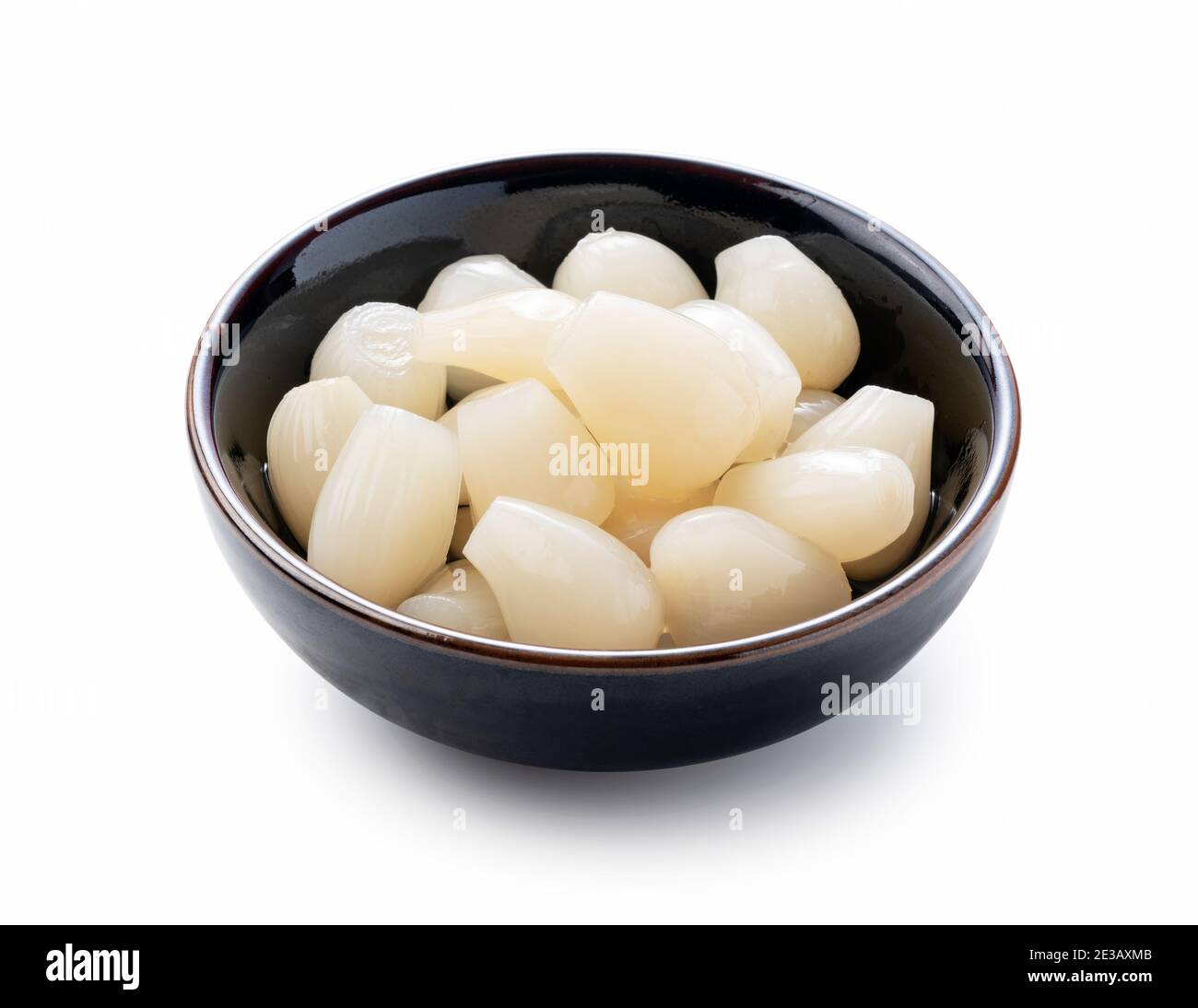 Japanese Rakkyo in a black bowl placed on a white background Stock ...