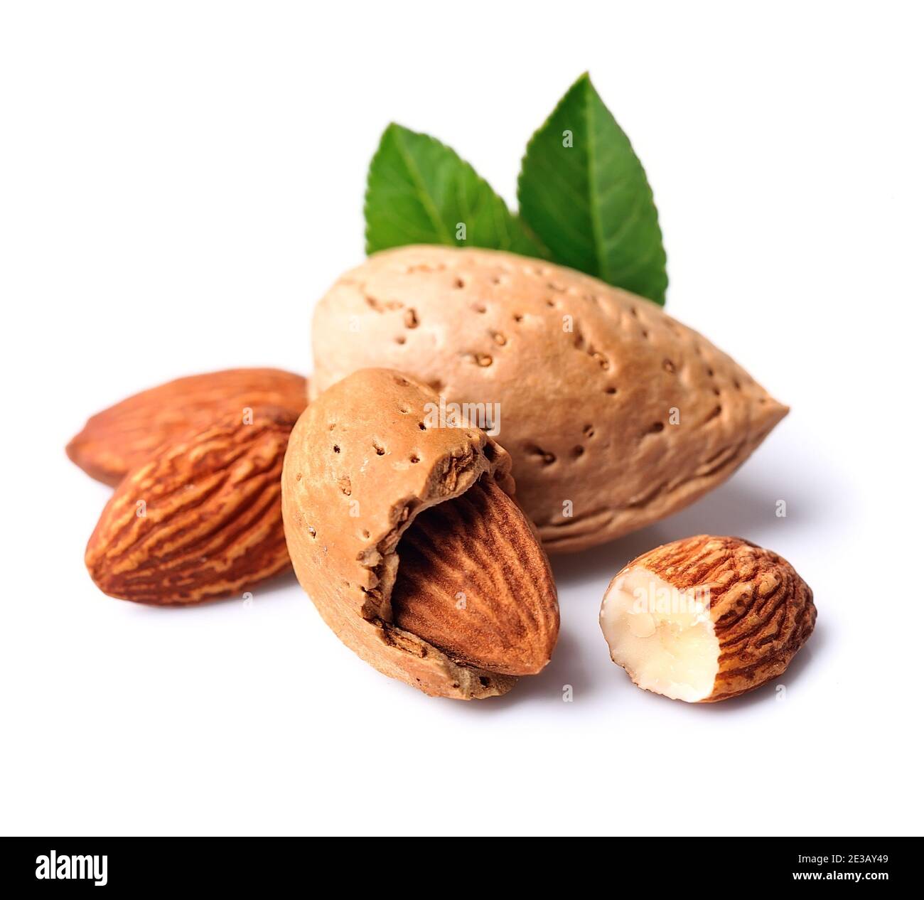Almonds nuts with leaves on white backgrounds Stock Photo - Alamy