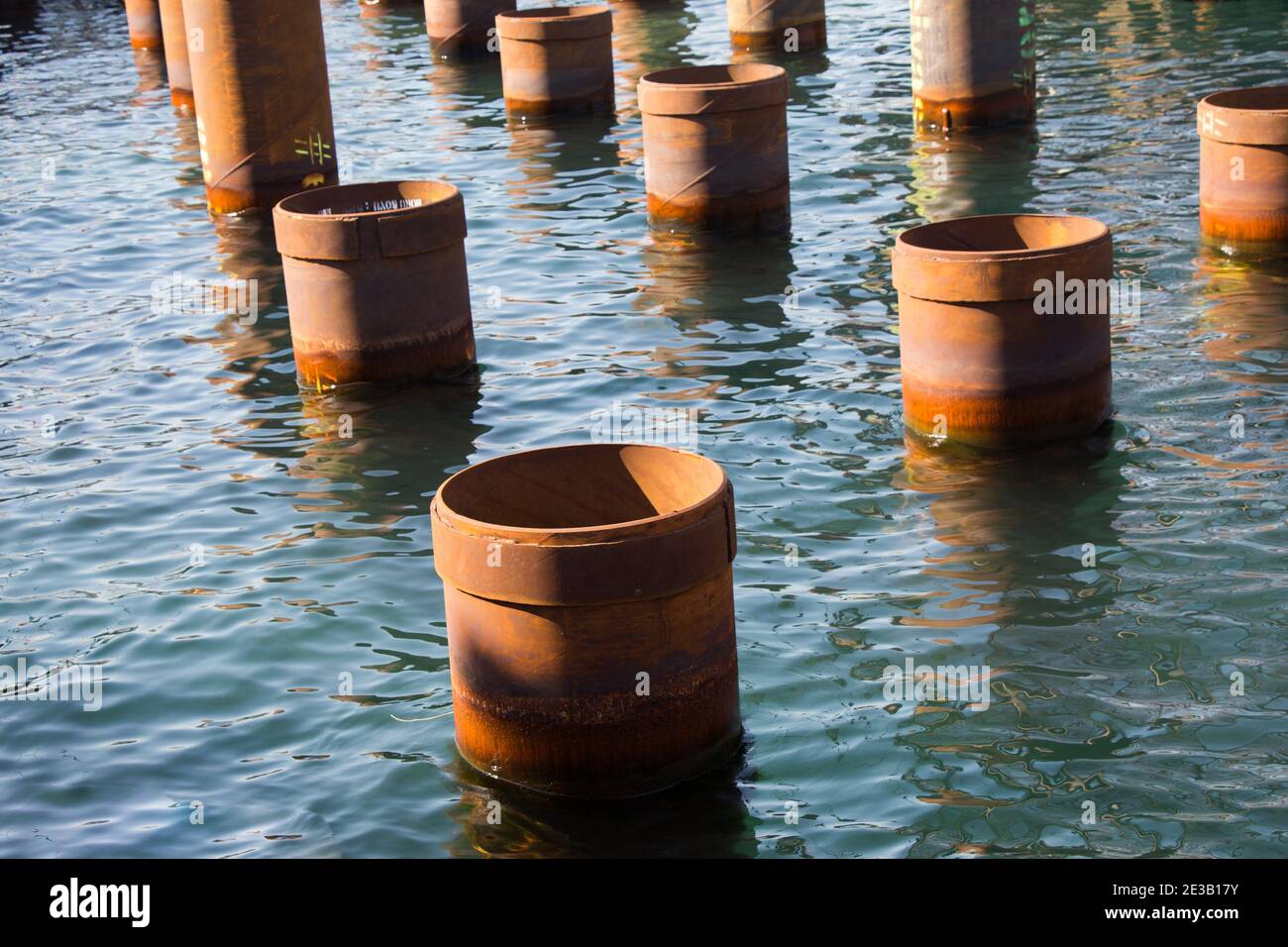 Shot of iron pipes in the water Stock Photo - Alamy