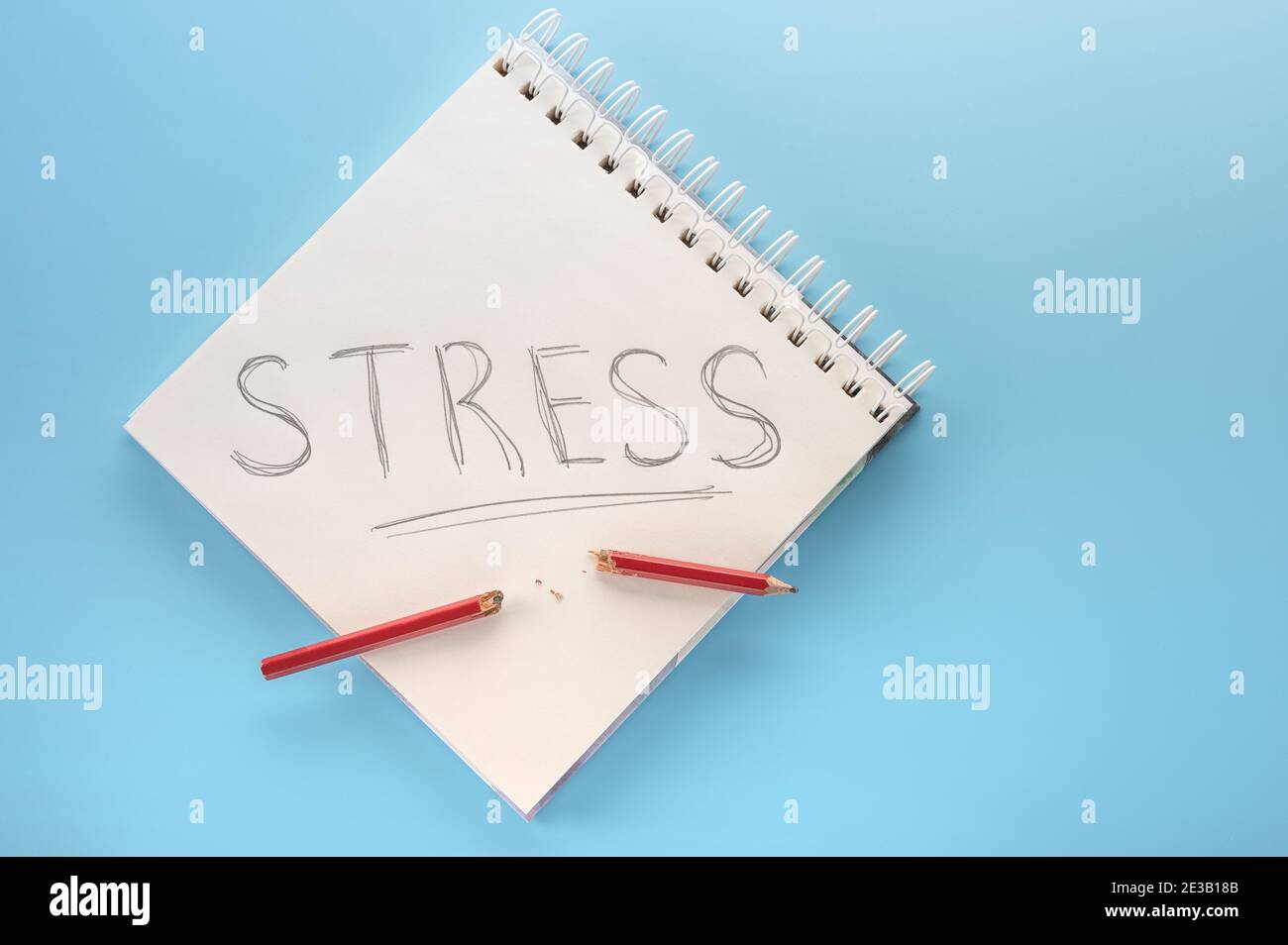 stress relief concept. notepad with word stress and broken pencil in ...