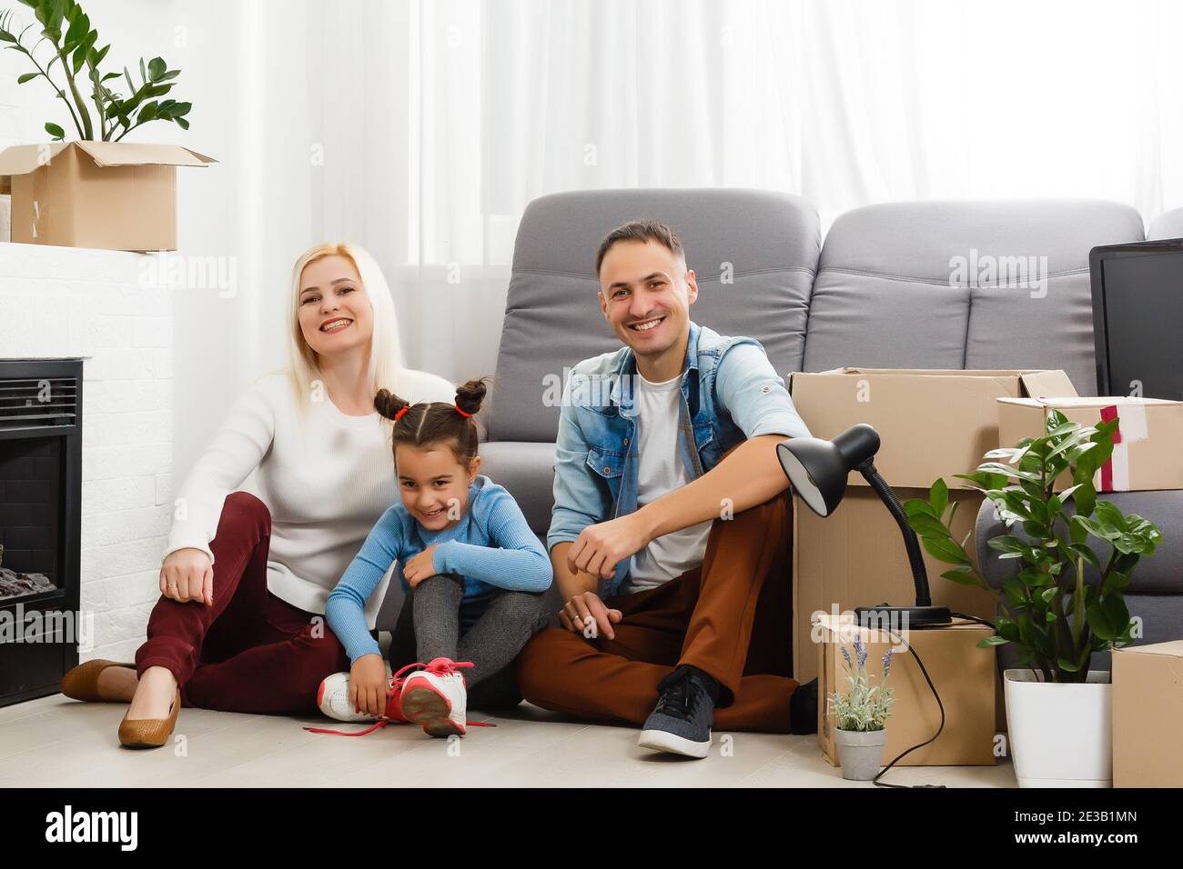 concept housing a young family. Mother father and child in new house ...