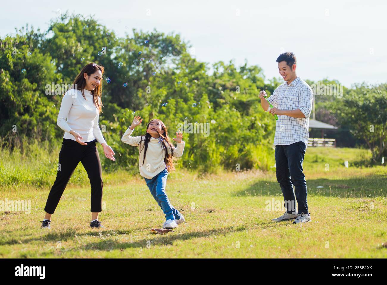 Happy Asian lifestyle family mother, father and little cute girl child ...