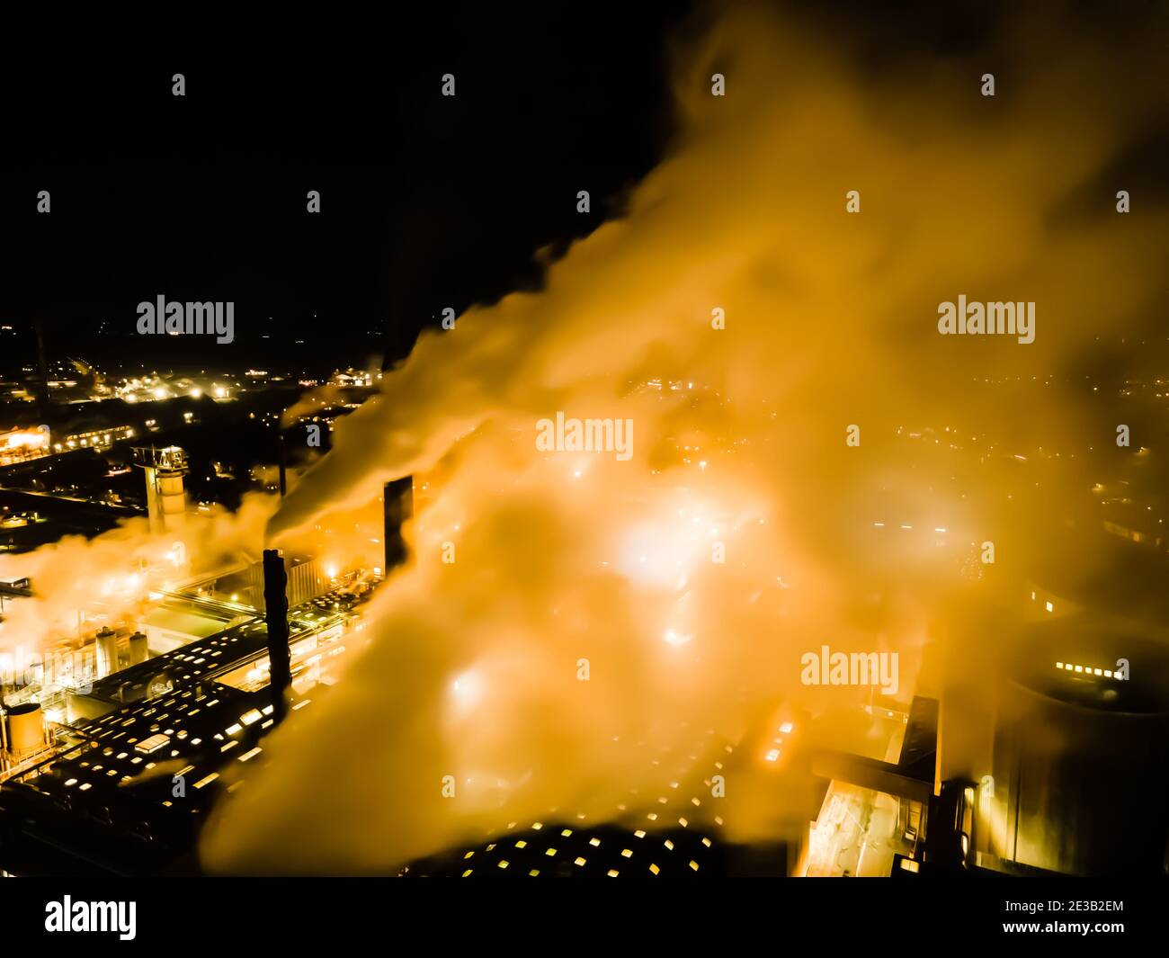 Large factory with thick white smoke coming from the chimneys Stock ...