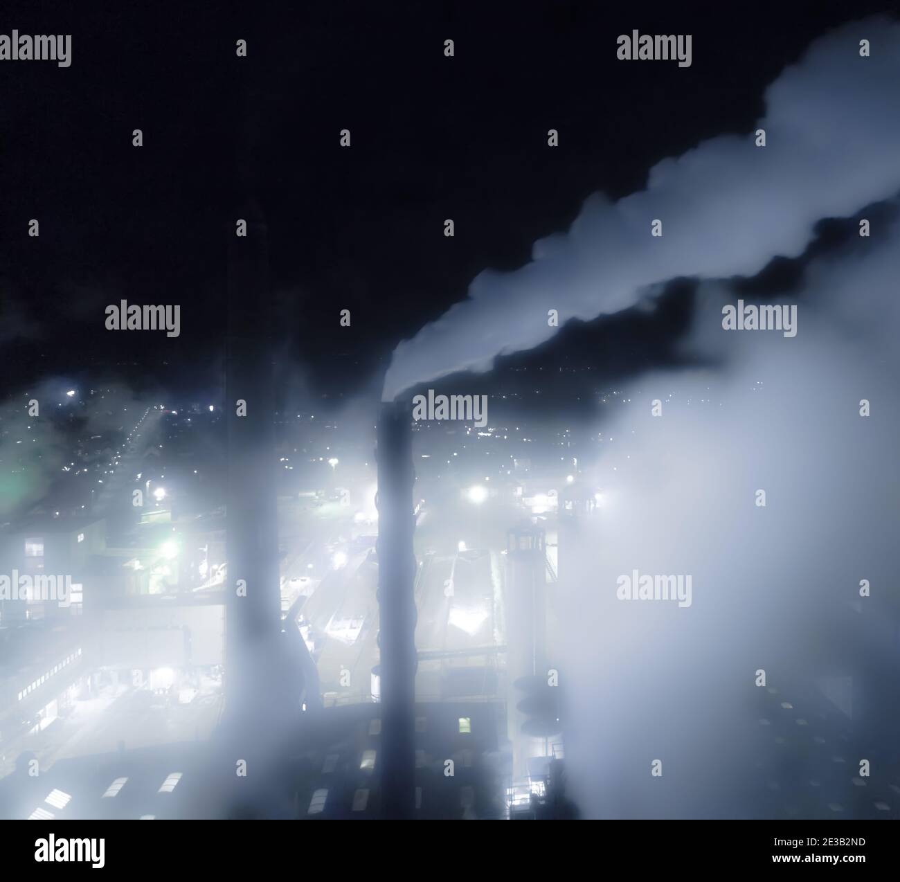 Large factory with thick white smoke coming from the chimneys Stock ...