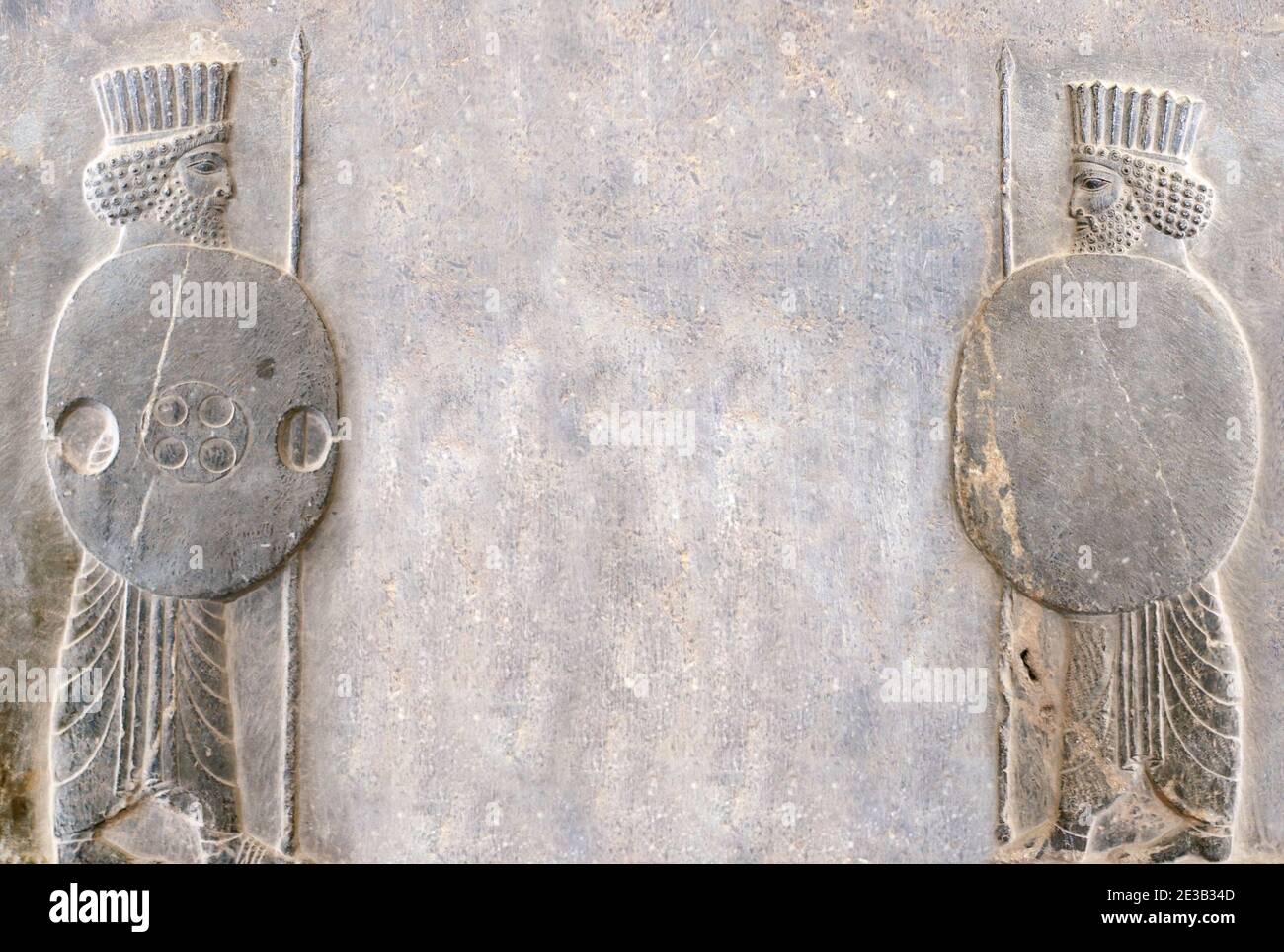 Ancient Wall With Bas Relief Two Assyrian Warriors With Spear And Shield Persepolis Iran