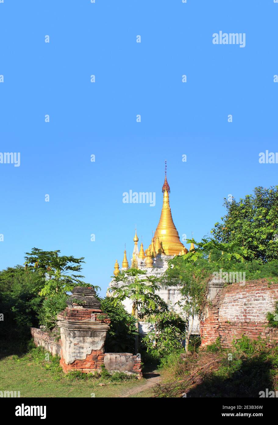 Biggest monastery and golden stupa, Myanmar(Burma). On blue sky ...