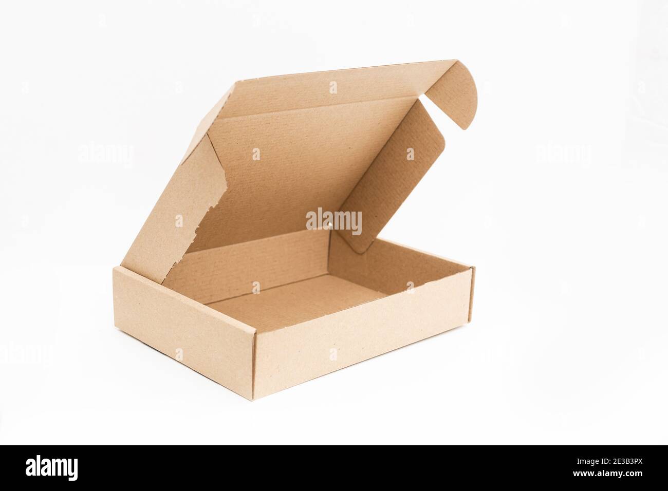 empty open cardboard box on surface with empty space Stock Photo - Alamy