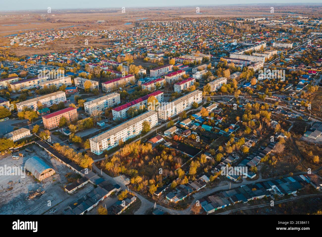 Small post soviet suburb town with low-rise apartment building aerial ...
