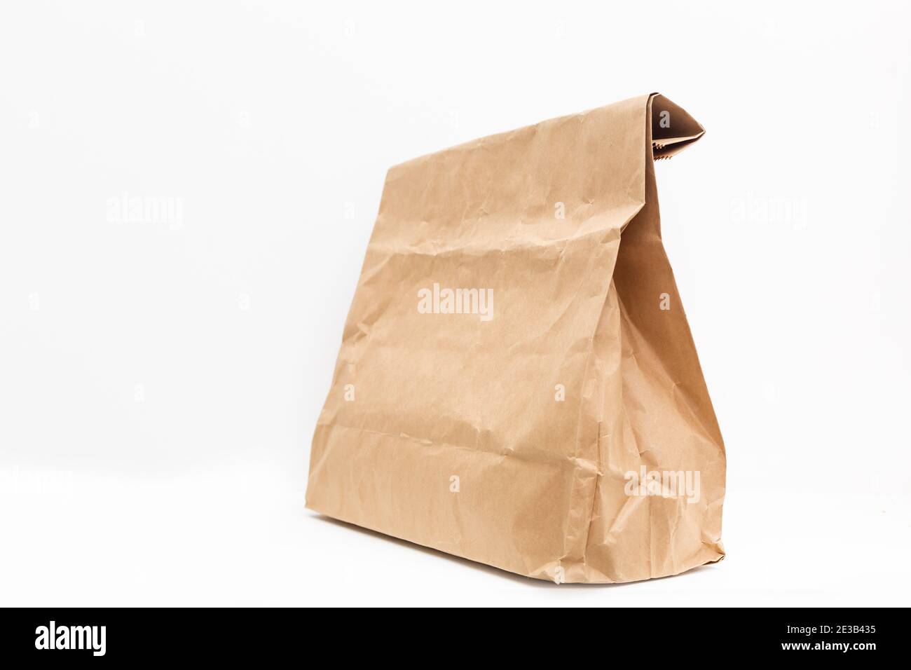 brown package for delivery on white background Stock Photo - Alamy