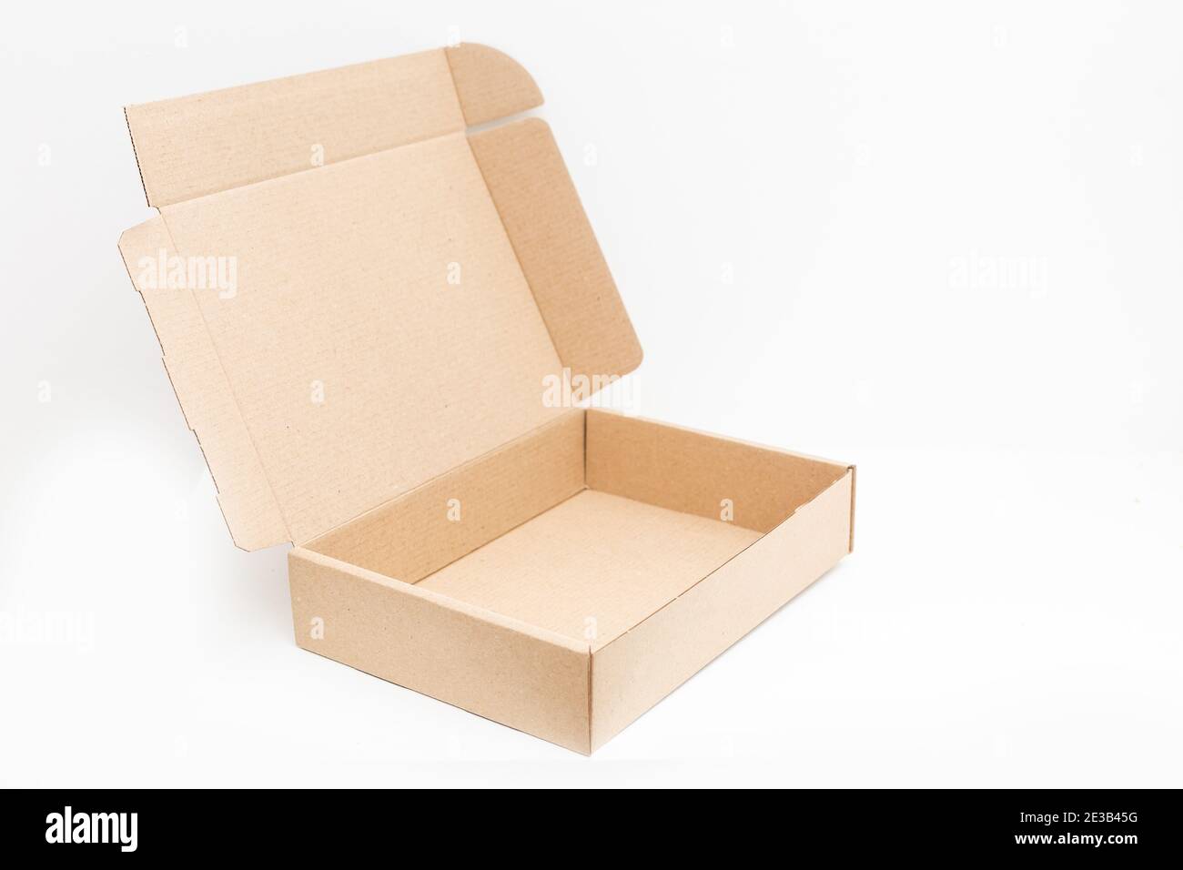 empty open cardboard box on surface with empty space Stock Photo - Alamy