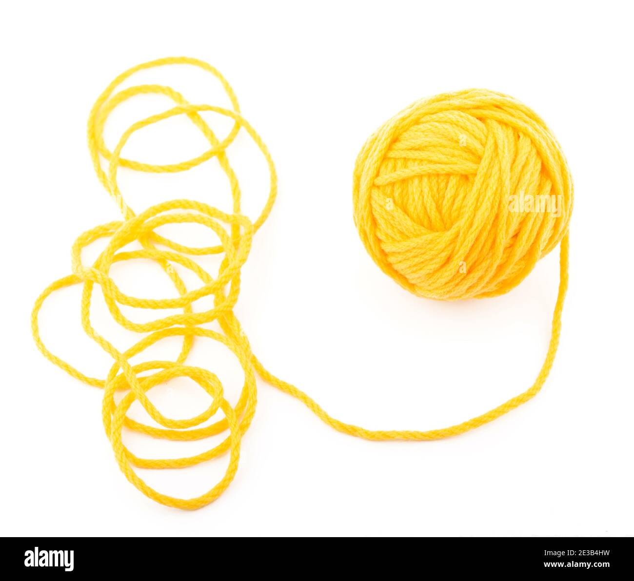 The idea is a tangled thread. Yellow ball of yarn on white background ...