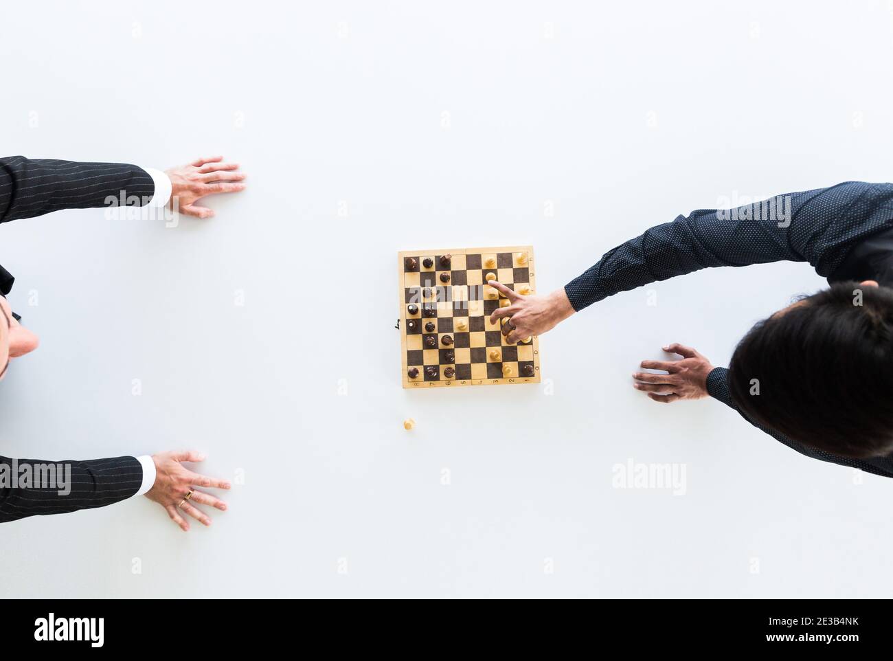 two male businessmen, rivals are playing chess. Strategy and rivalry ...