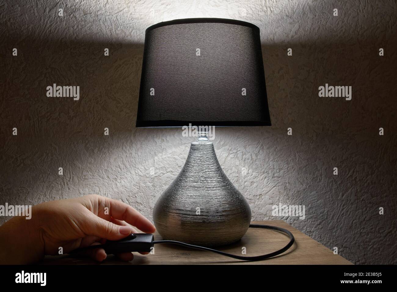 Womans hand light switch hi-res stock photography and images - Alamy