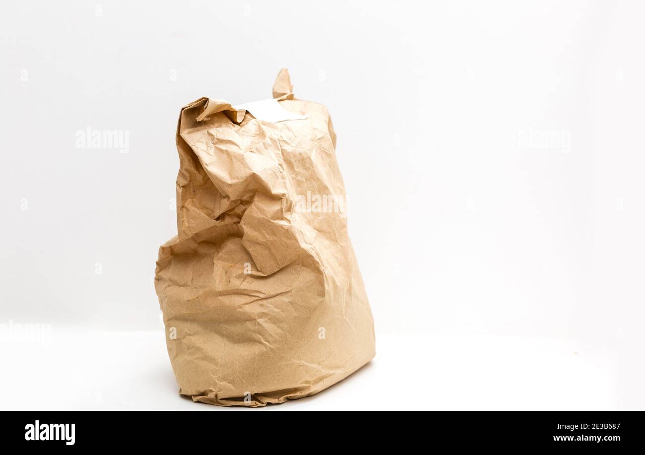 brown package for delivery on white background Stock Photo - Alamy