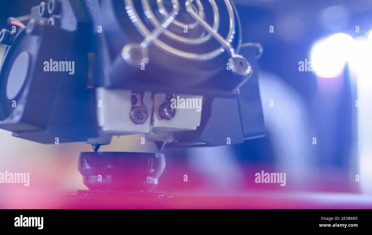 Three dimensional printing machine prints physical 3D model - close up ...
