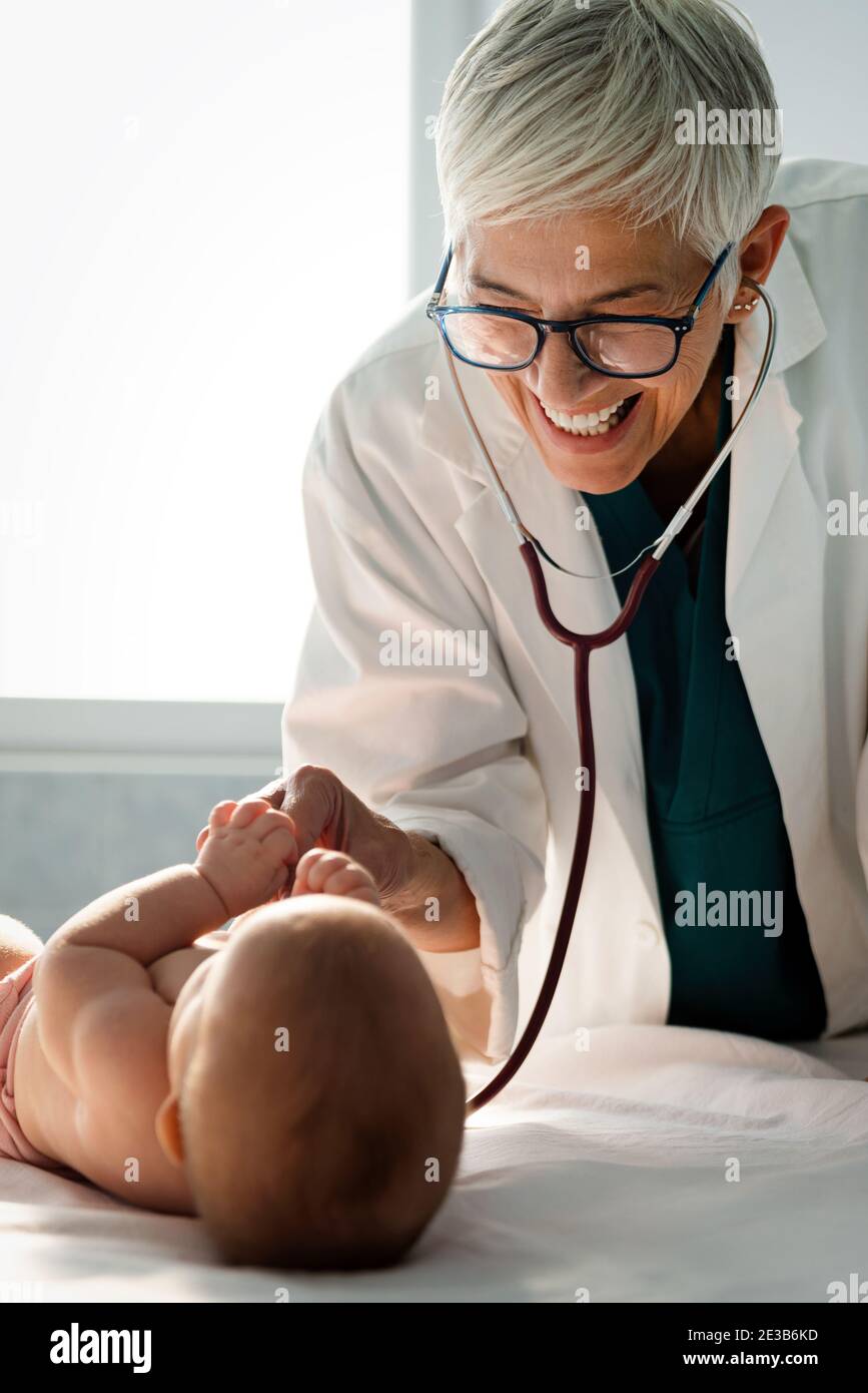 Pediatric doctor exams little baby. Health care, medical examination ...