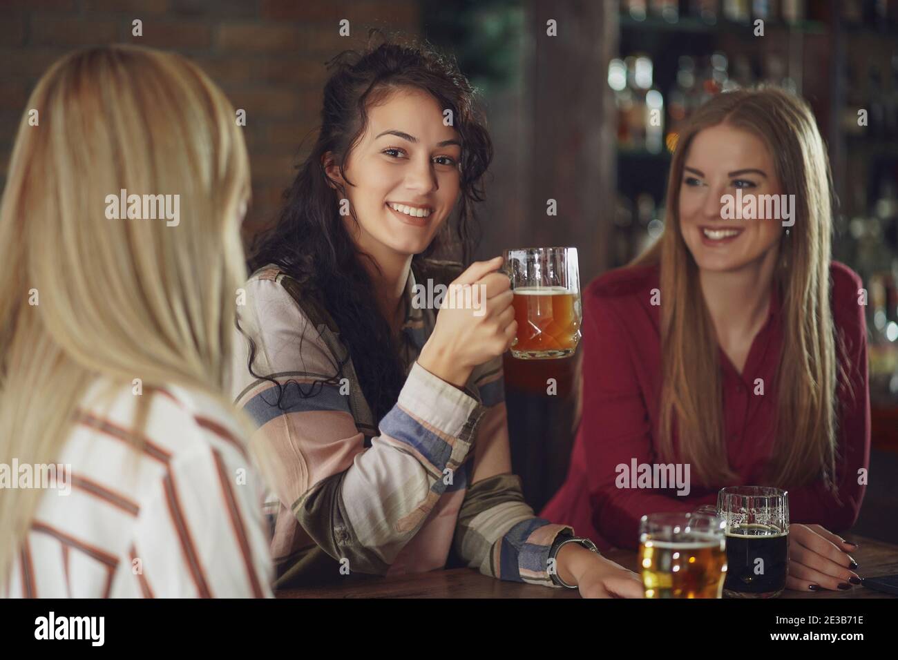 Blonde girl drinking beer hi-res stock photography and images - Alamy