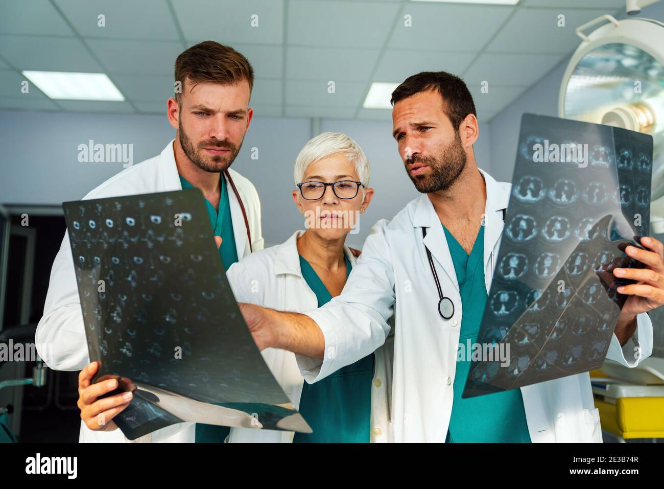 Group of doctor looking at ct scan at hospital to make diagnosis Stock Photo - Alamy