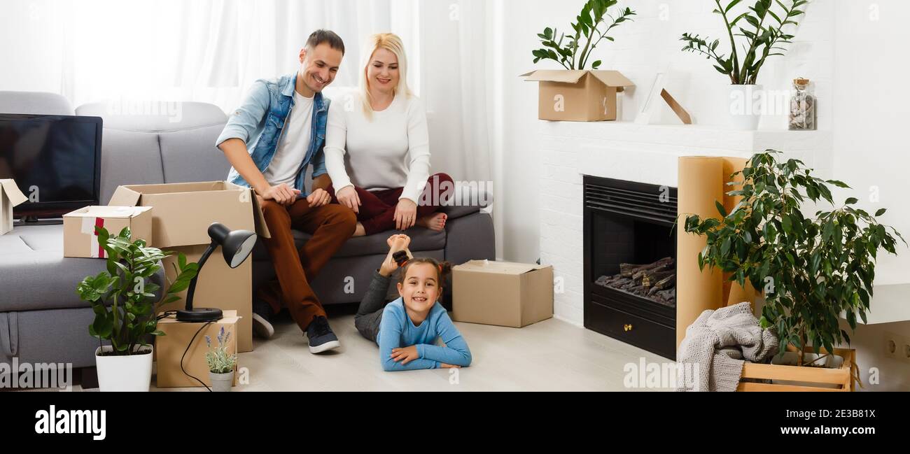 concept housing a young family. Mother father and child in new house ...