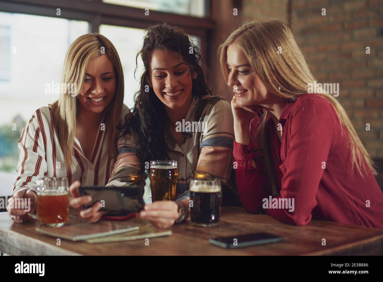 Blonde girl drinking beer hi-res stock photography and images - Alamy