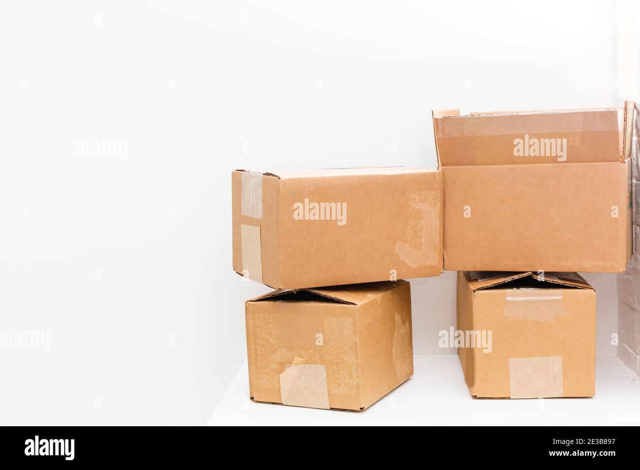 Lot of cardboard boxes on white background Stock Photo - Alamy