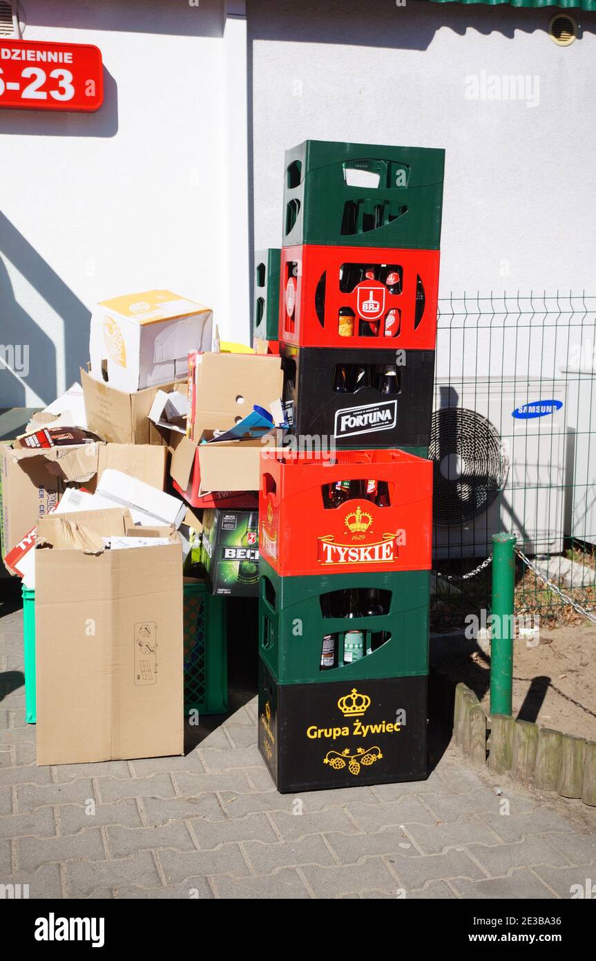 POZNAN, POLAND - Mar 26, 2017: Stacked beer crates in front of a Zabka ...