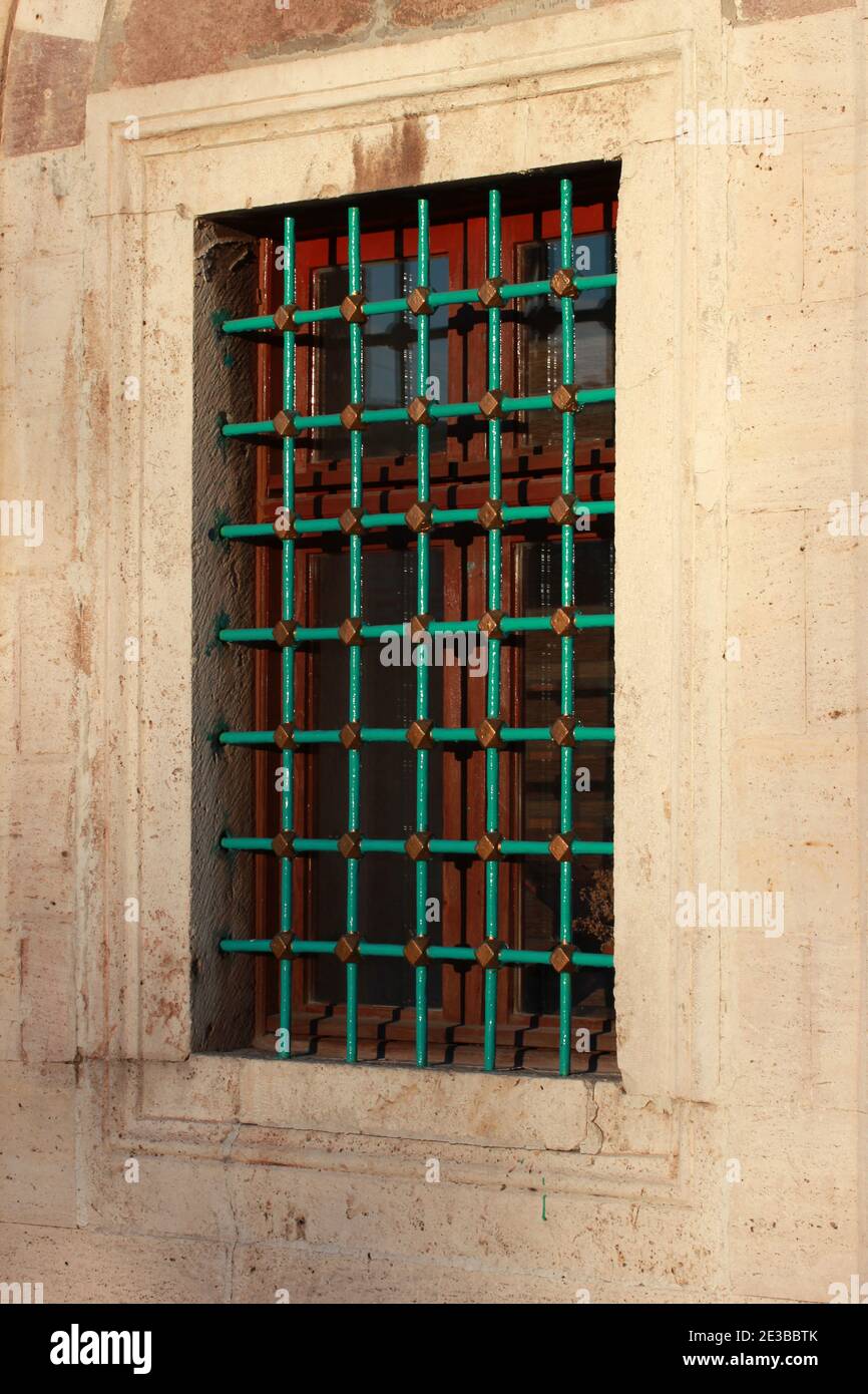 The old stone building. Metal window railing Stock Photo - Alamy