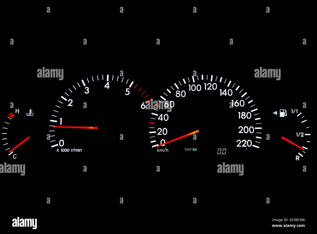 A cars dashboard panels lit up at night with European speedometer Stock ...
