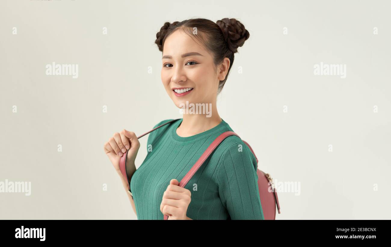 Woman holding her backpack hi-res stock photography and images - Alamy