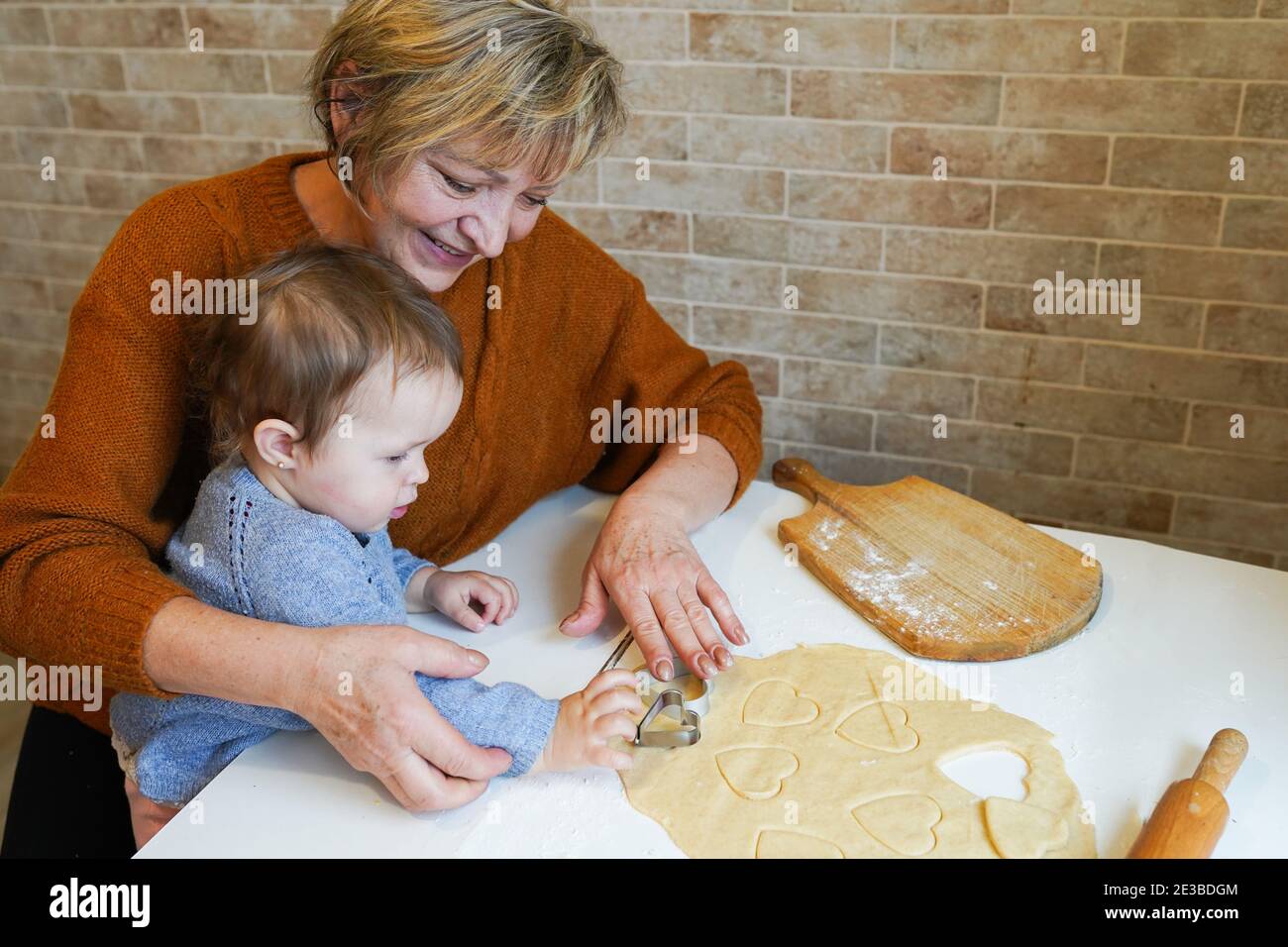 Old woman baking cookies hi-res stock photography and images - Alamy