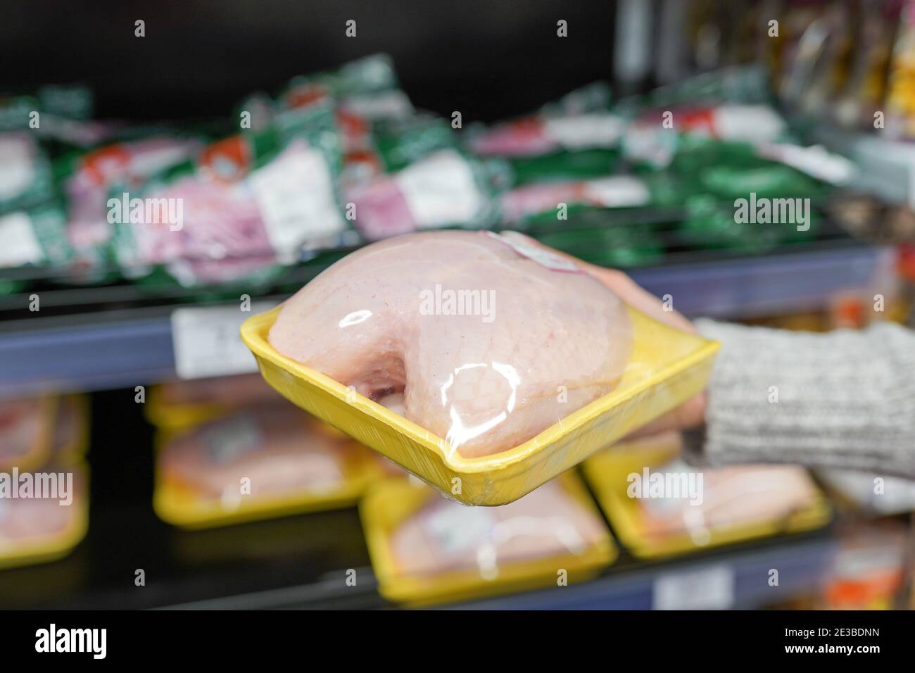 Image of packaged hen meat with woman hand in the supermarket Stock ...